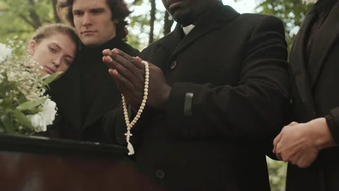 Mourning People and Priest at Funeral Ce... | Stock Video | Pond5