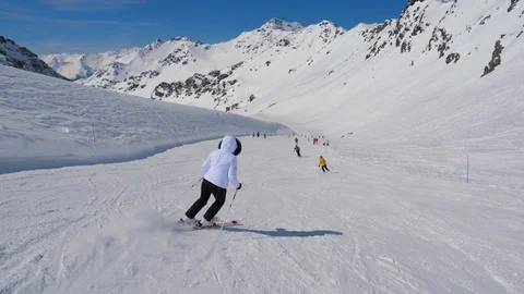 In Movement Back View, Woman Skier Skiin... | Stock Video | Pond5