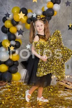 Movie super star girl model posing in studio shoot with golden star and ...