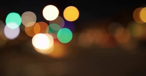 Moving car bokeh with traffic lights in ... | Stock Video | Pond5