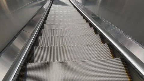 Moving escalator stairs. Automated eleva... | Stock Video | Pond5