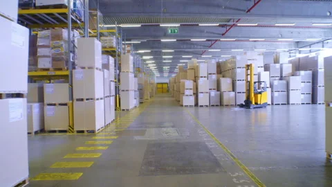 Moving inside empty warehouse aisle with... | Stock Video | Pond5