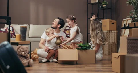 Moving in process concept happy young fa... | Stock Video | Pond5