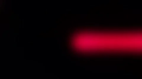 A moving red light on a black screen | Stock Video | Pond5