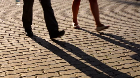 Moving shadows of walking couple and mot... | Stock Video | Pond5