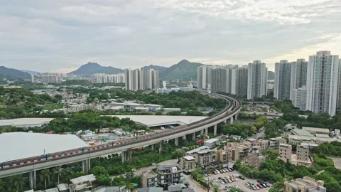 MTR Tuen Ma Line crossing bridge towards... | Stock Video | Pond5