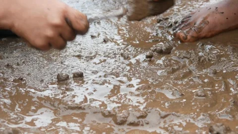 Mud covered hands of a child. Children ... | Stock Video | Pond5