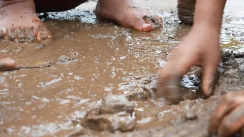 Mud covered hands of a child. Children ... | Stock Video | Pond5