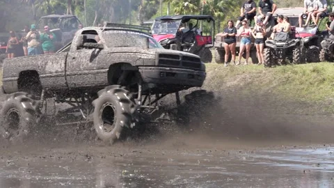 Mud Trucks and Wheels Busy Pit Mud Flyin... | Stock Video | Pond5