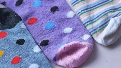multi color kid socks on table | Stock Video | Pond5