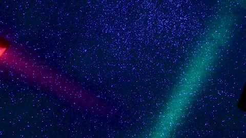 Multi-colored beams of light blink on a ... | Stock Video | Pond5