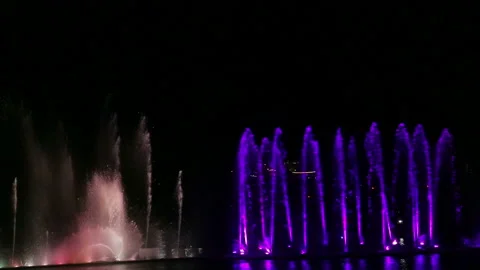 Multi-colored jet fountains show on the ... | Stock Video | Pond5
