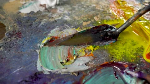 Multi-colored oil paints on an artistic ... | Stock Video | Pond5