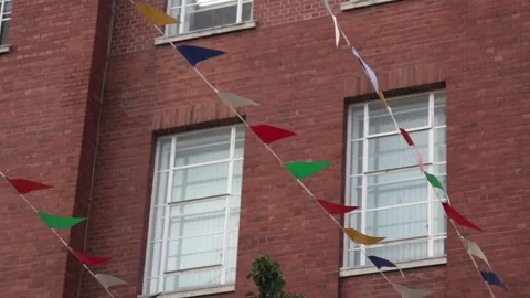 Multi coloured bunting flags blowing in ... | Stock Video | Pond5