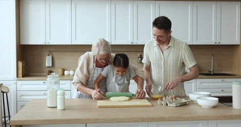 Multi-generational family cooking togeth... | Stock Video | Pond5