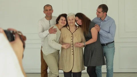 Multi-generations family poses to a phot... | Stock Video | Pond5