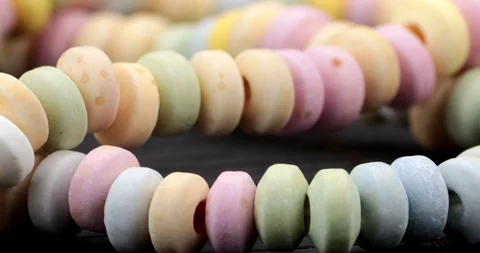 Multicolored candy chain on black backgr... | Stock Video | Pond5