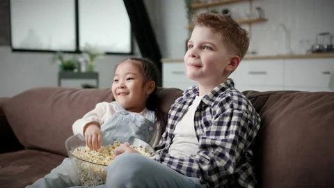Multiethnic Kids Eating Popcorn Sitting ... | Stock Video | Pond5