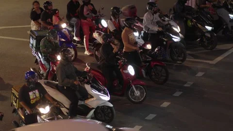 Multiple mopeds lined up at a busy Bangk... | Stock Video | Pond5