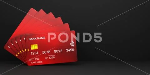 Multiple red credit cards isolated on black background with free space ...