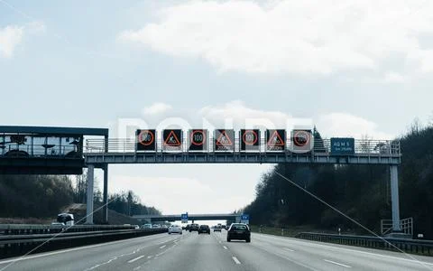 Multiple warning signs above autobahn slow down roadworks Stock Photo ...