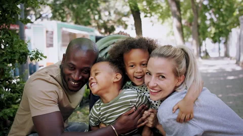 Multiracial family on walk in public par... | Stock Video | Pond5