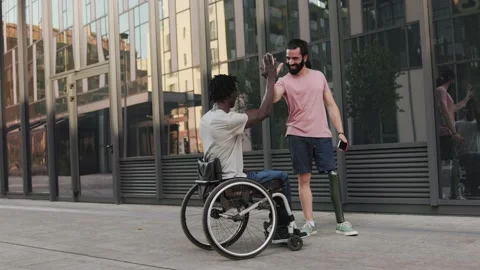 Multiracial friends with physical disabi... | Stock Video | Pond5