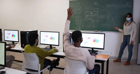 Multiracial students using computers ins... | Stock Video | Pond5
