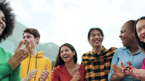 Multiracial young friends clapping hands... | Stock Video | Pond5