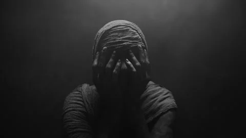 A Mummy Covering its face and crying | Stock Video | Pond5