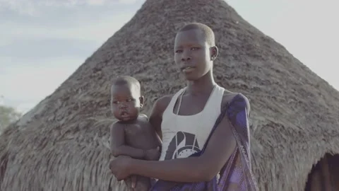 Mundari tribe mother with her child, Ter... | Stock Video | Pond5