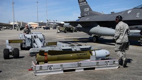 Munitions being loaded onto bomb loader | Stock Video | Pond5