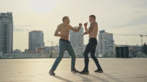 muscular and shirtless men fighting on r... | Stock Video | Pond5