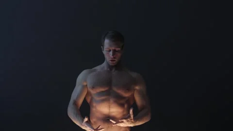 A muscular athlete in an epic pose, fog ... | Stock Video | Pond5