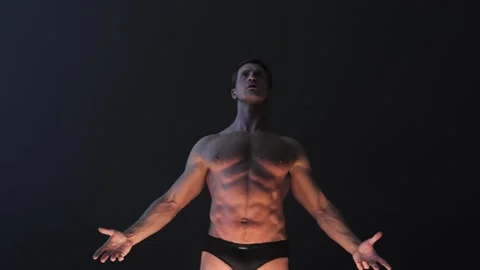 A muscular athlete in an epic pose, fog ... | Stock Video | Pond5