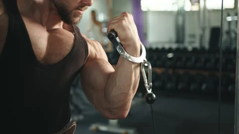 muscular athlete pumps biceps in the cab... | Stock Video | Pond5