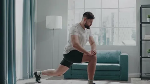 Muscular bodybuilder with beard stretche... | Stock Video | Pond5