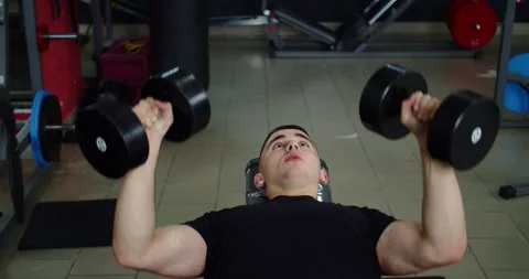 Muscular bodybuilder man lifting heavy w... | Stock Video | Pond5