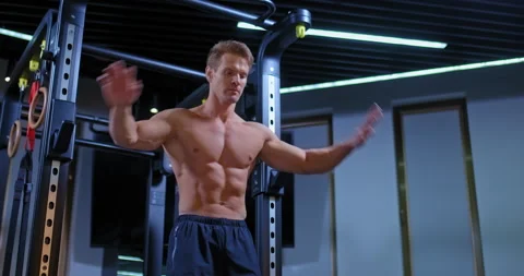 Muscular bodybuilder straining his muscl... | Stock Video | Pond5