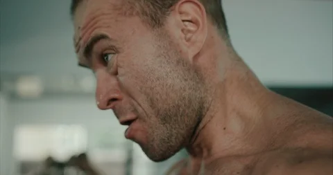 Muscular male bodybuilder's face during ... | Stock Video | Pond5