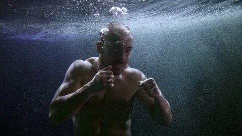 a muscular man with a bare torso raised ... | Stock Video | Pond5