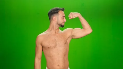 Muscular Man Flexing Biceps on Green Scr... | Stock Video | Pond5