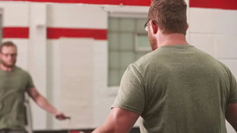 Muscular man jumping rope inside of gym,... | Stock Video | Pond5
