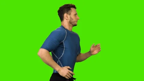 Muscular man running over a green screen... | Stock Video | Pond5