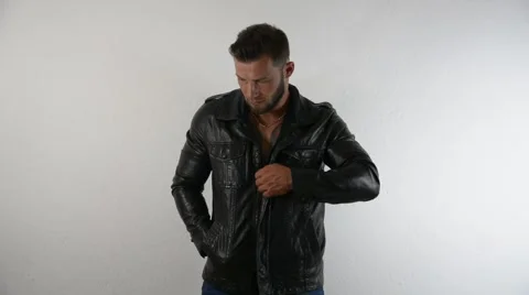 Muscular man undressing, taking off jack... | Stock Video | Pond5