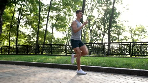 muscular man warming up with back lunge ... | Stock Video | Pond5