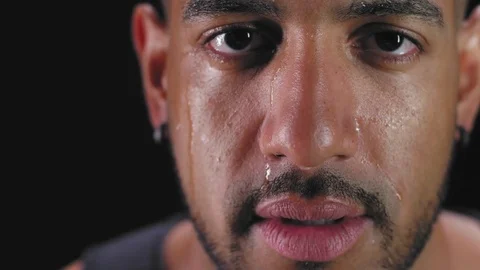 Muscular man wiping the sweat off his fo... | Stock Video | Pond5