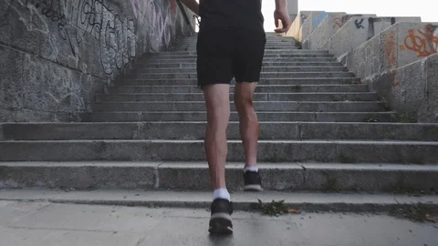 Muscular strong tanned male legs run up ... | Stock Video | Pond5