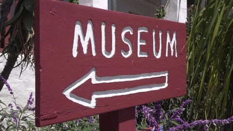 Museum entrance sign with arrow pointing... | Stock Video | Pond5