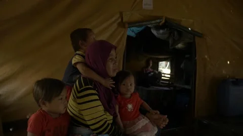 A Muslim family living in a tent shelter | Stock Video | Pond5